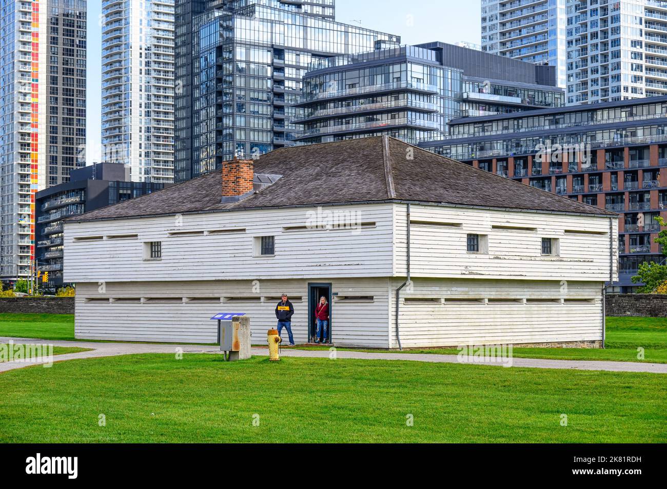 A military fortified wall building exterior. It is contrasting with the ...