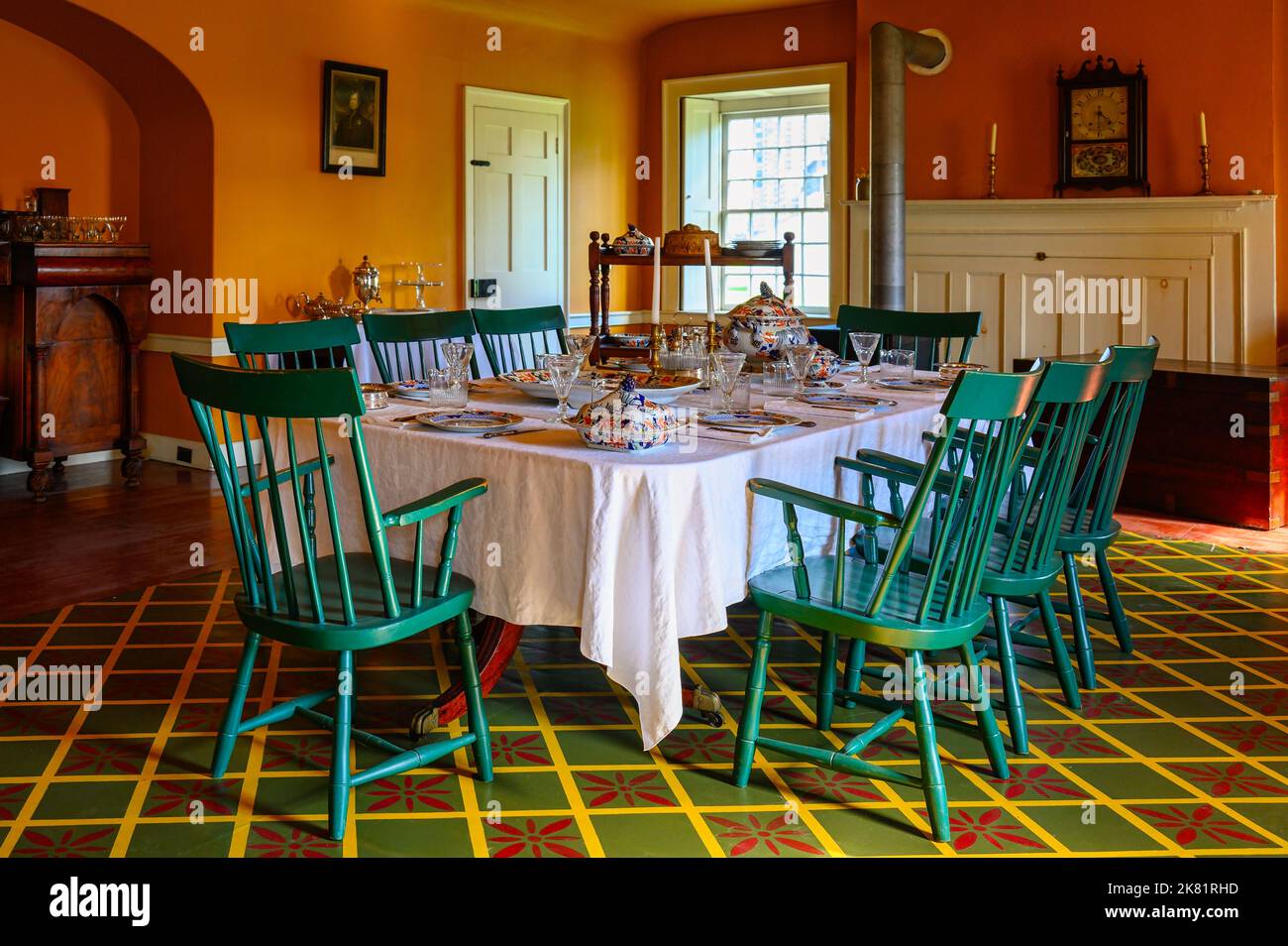 A table set with antique crockery. Interior colonial architecture and ...
