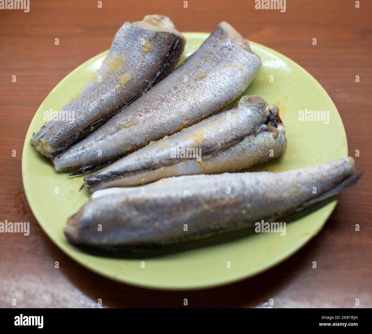 Raw hake fillet on plate hi-res stock photography and images - Alamy