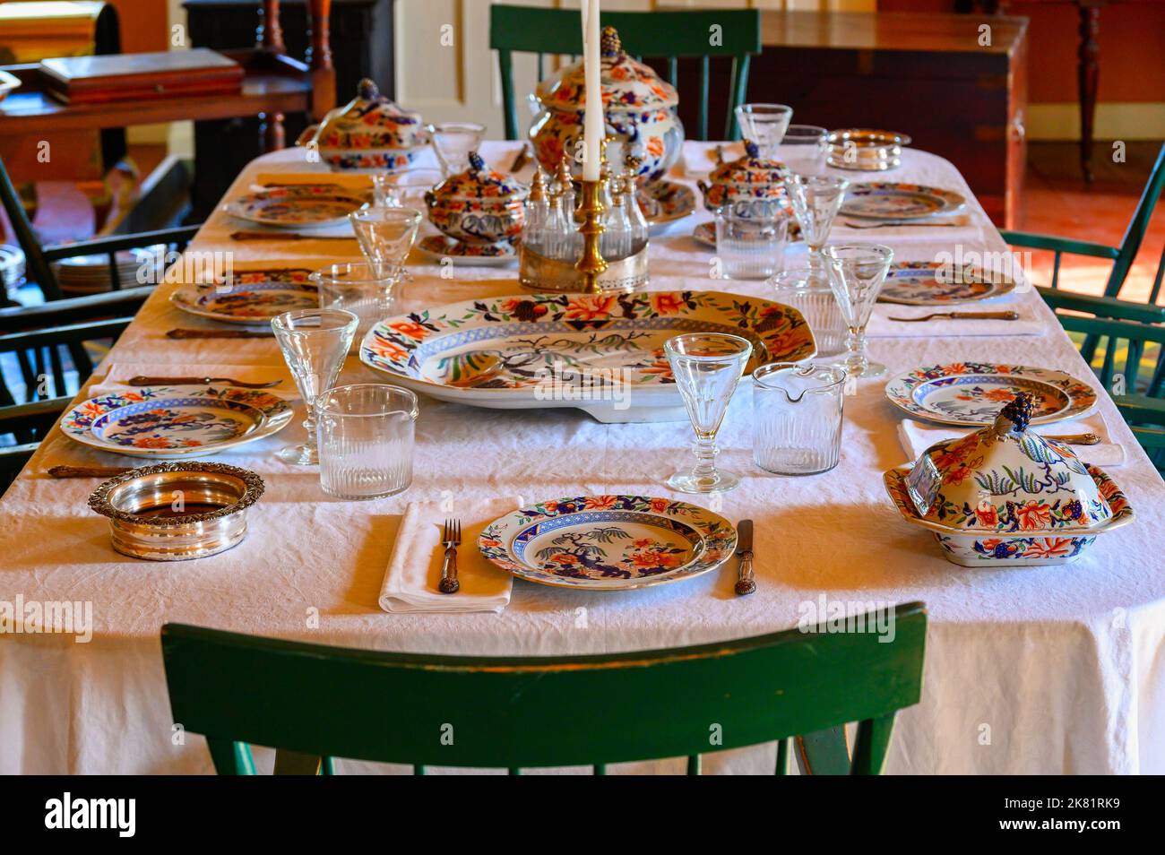 A table set with antique crockery. Interior colonial architecture and ...
