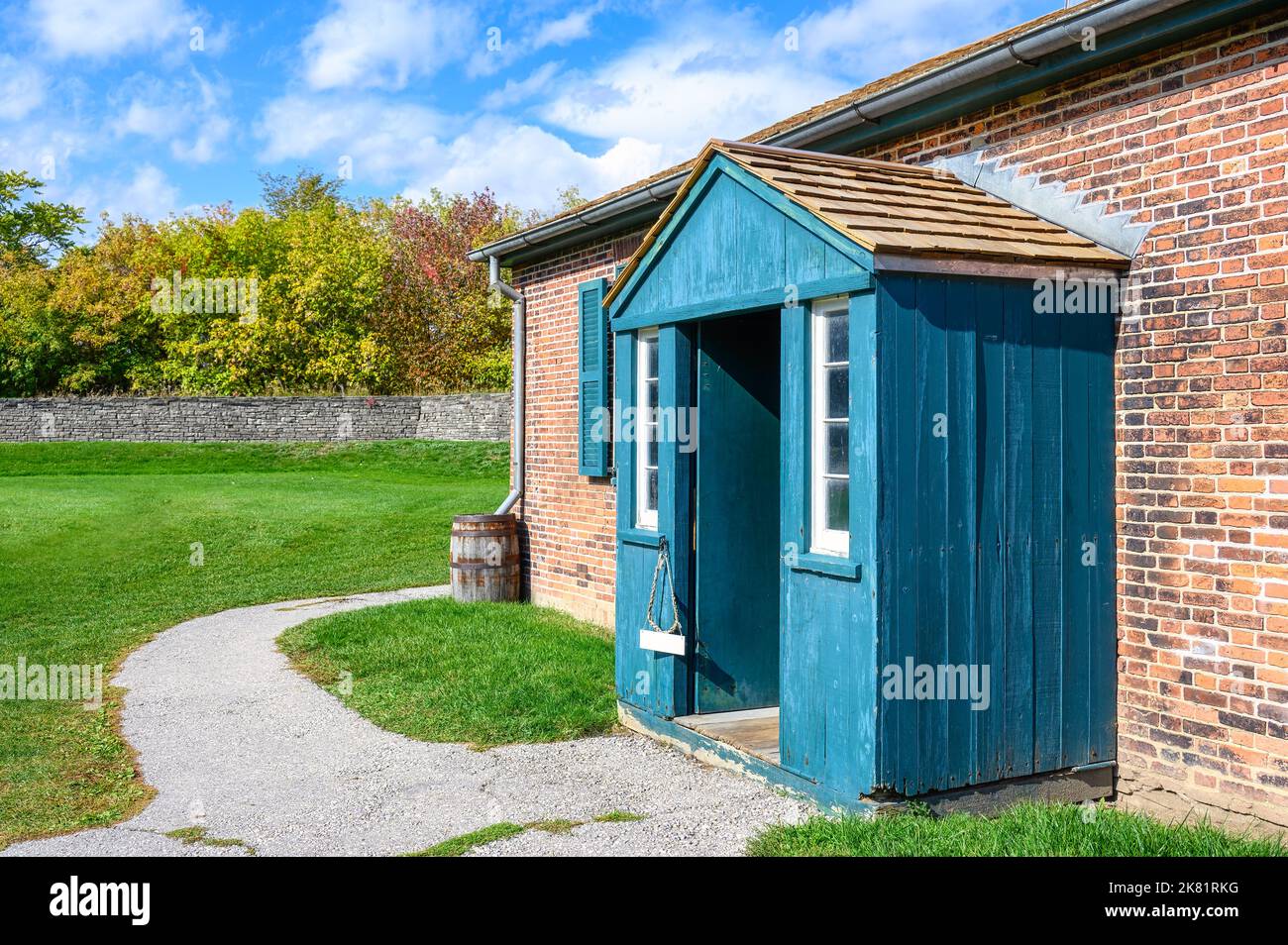 Entrance door in a colonial building with red brick walls. Fort York is ...