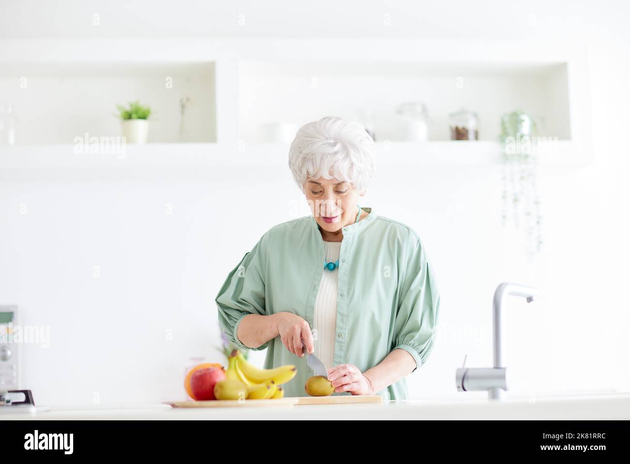Young woman cutting open hi-res stock photography and images - Alamy