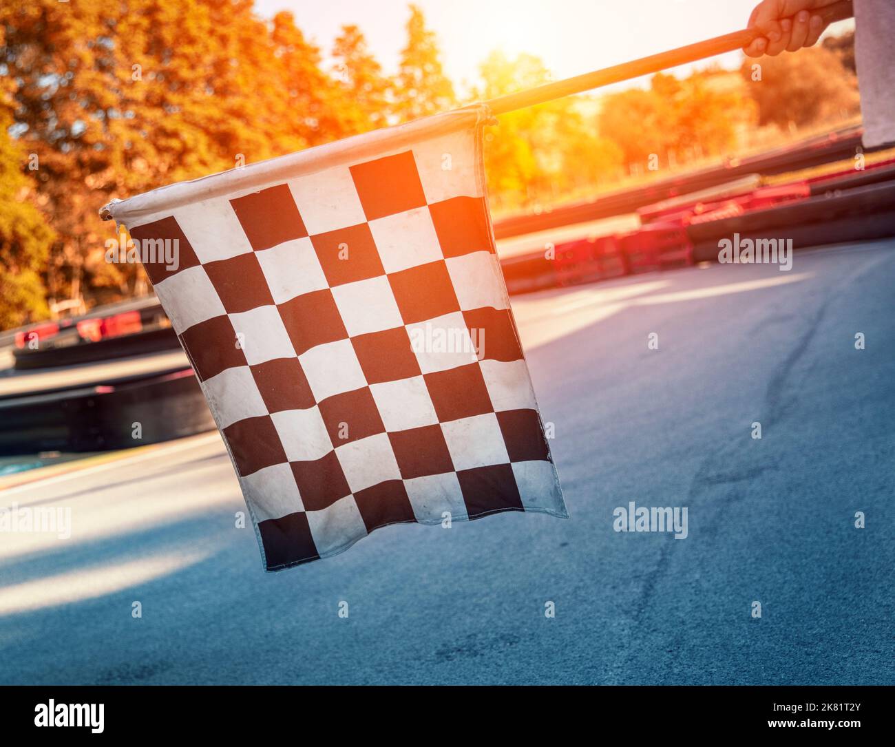 Checked flag at motorsport race track Stock Photo - Alamy
