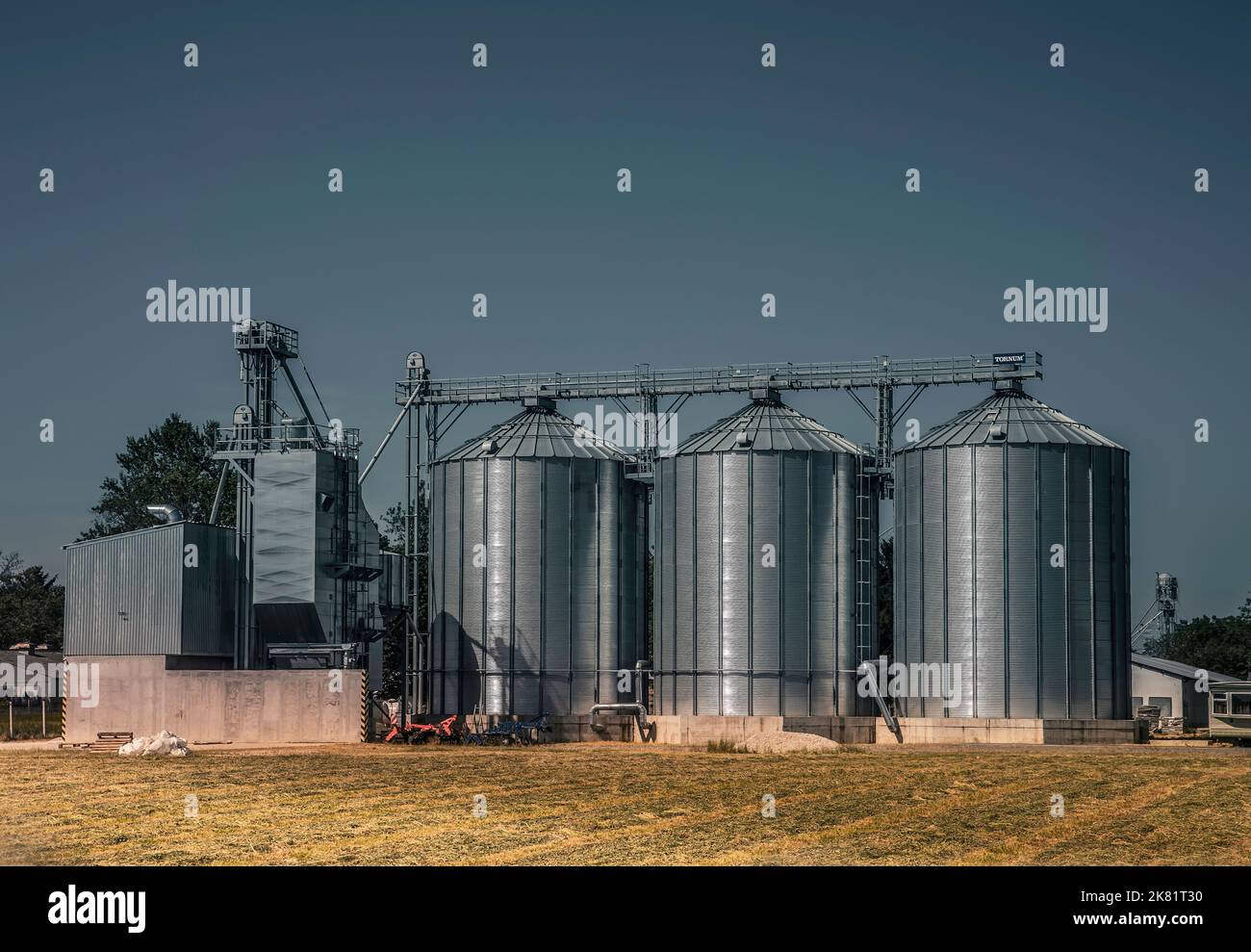 Farm, wheat field with grain silos for agriculture Stock Photo - Alamy
