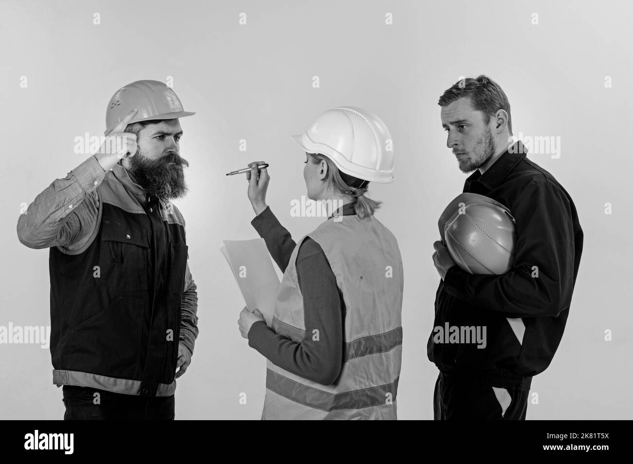 Labor dispute concept. Builders and engineer arguing, misunderstanding ...