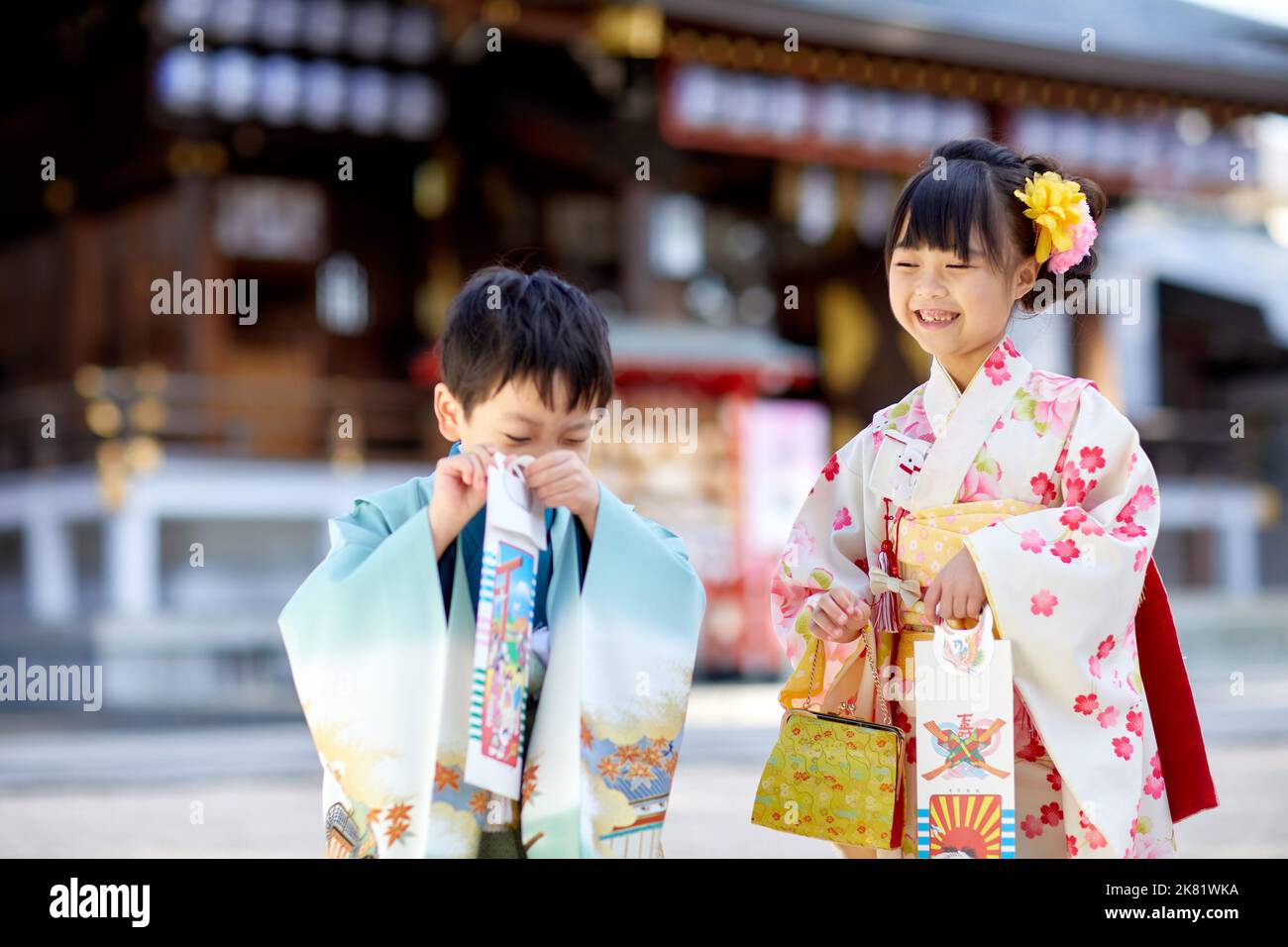 Girls wearing traditional kimonos in the temple hi-res stock ...