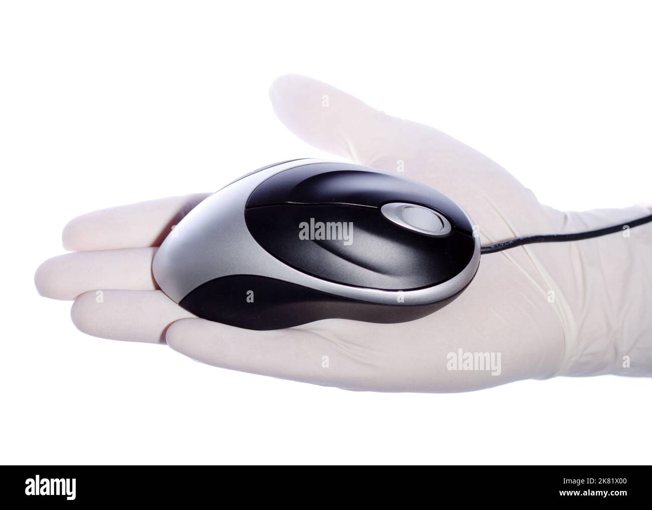 Computer mouse in gloved hand isolated on white Stock Photo - Alamy
