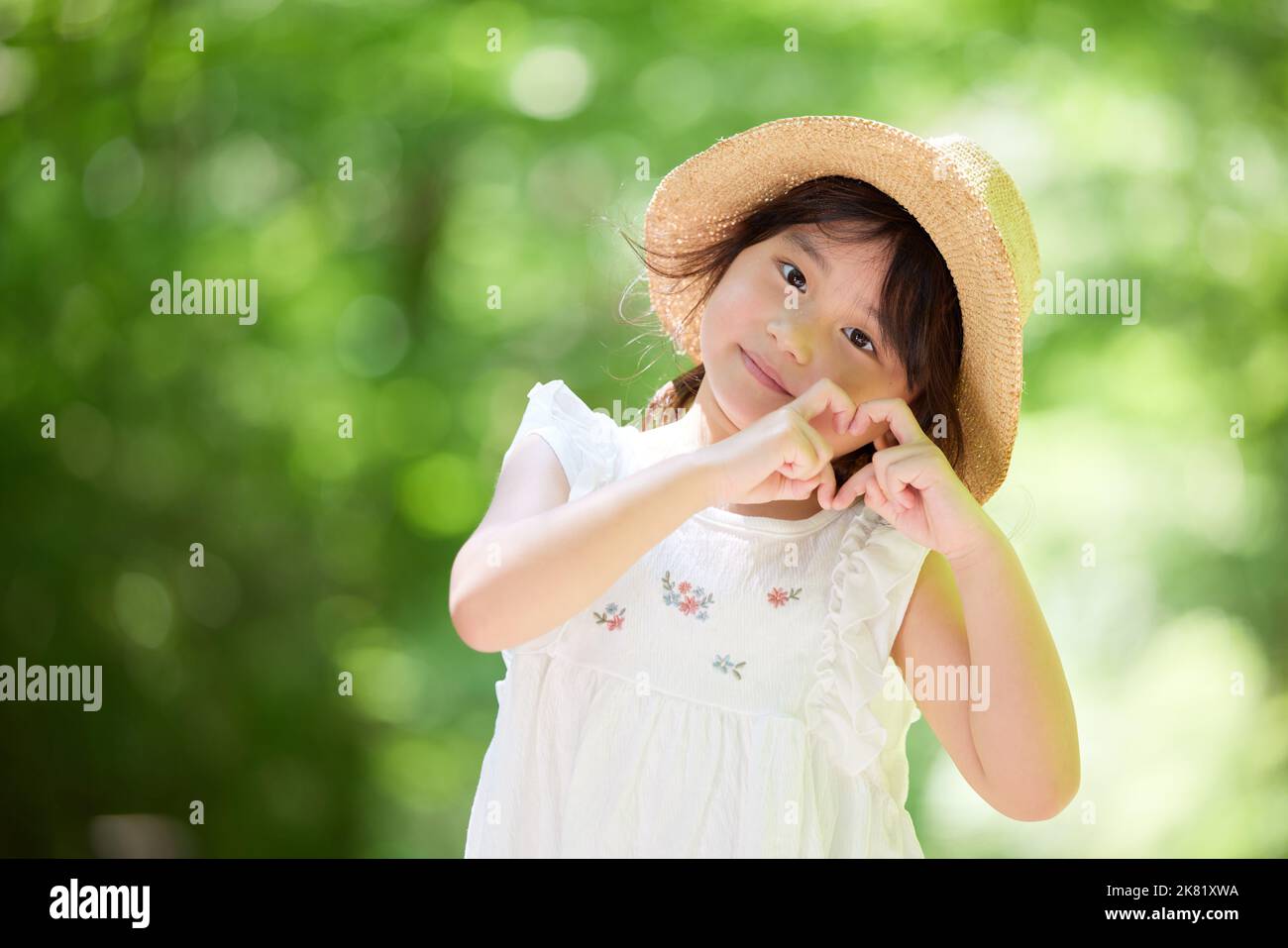Japanese kid portrait and green leaves Stock Photo - Alamy