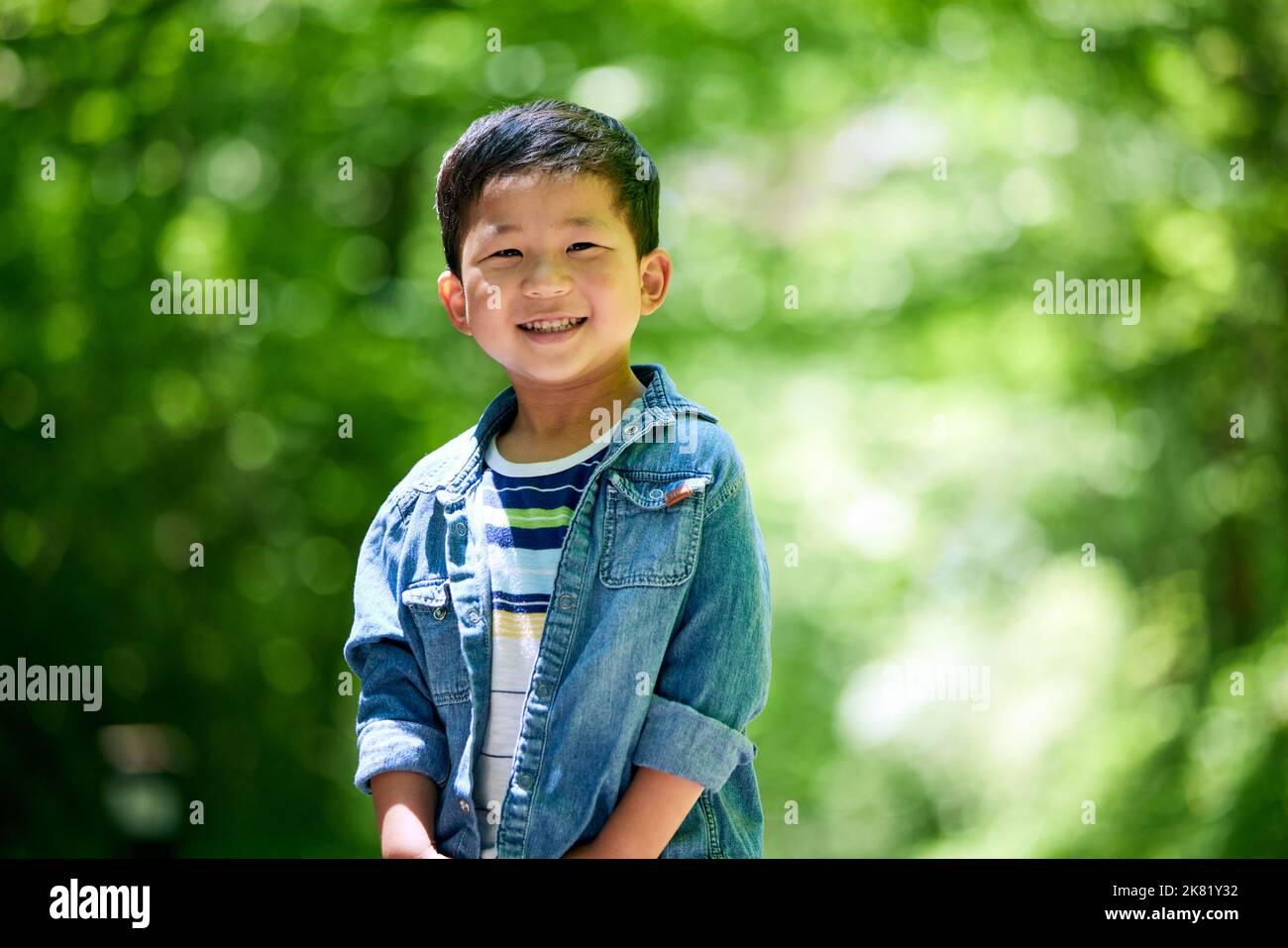 Japanese kid in a city park Stock Photo - Alamy