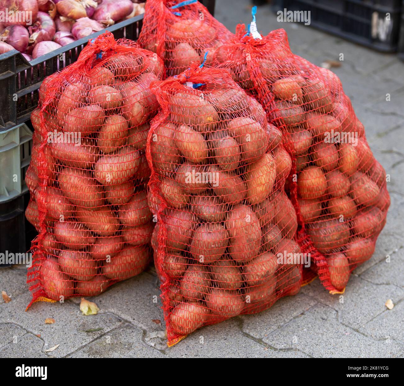 Potato packed in mesh bag at grocery Stock Photo - Alamy