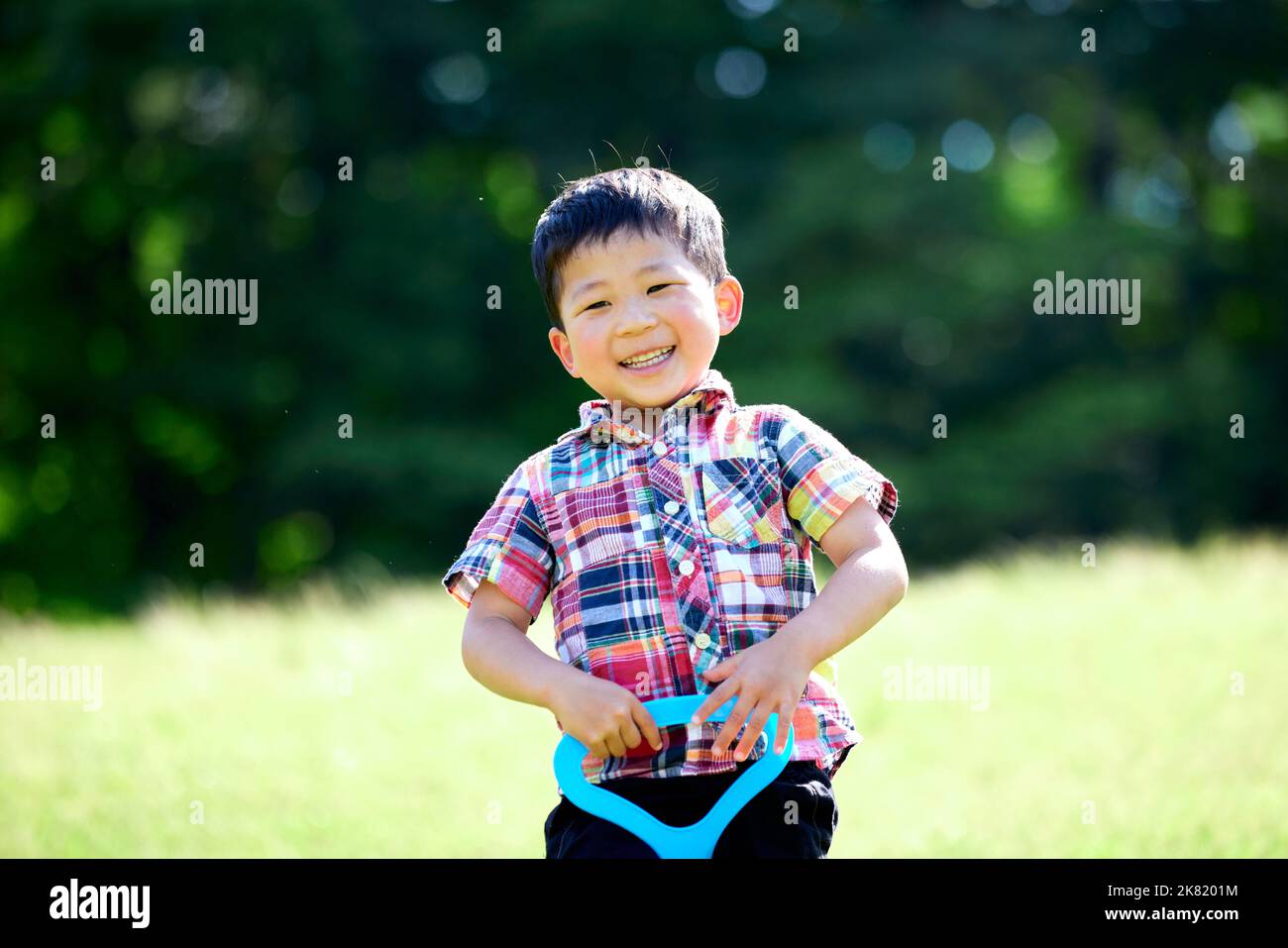 Japanese kid in a city park Stock Photo - Alamy