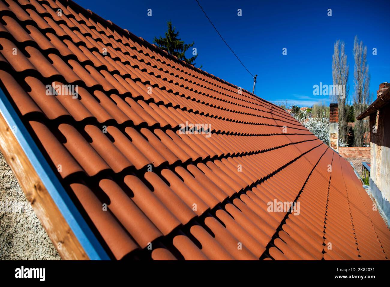 Red tiled roof at blue sky Stock Photo - Alamy