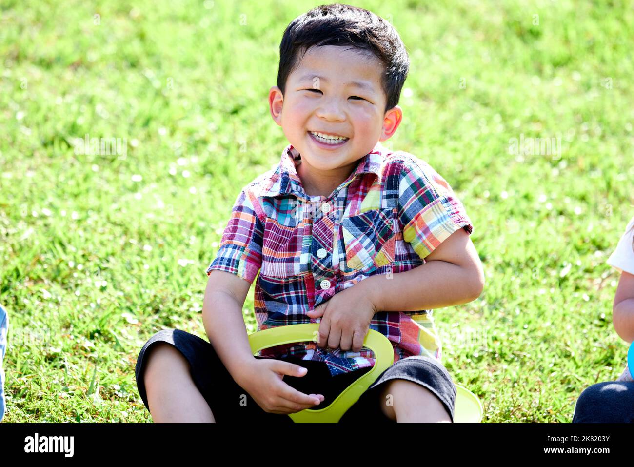 Japanese kid in a city park Stock Photo - Alamy