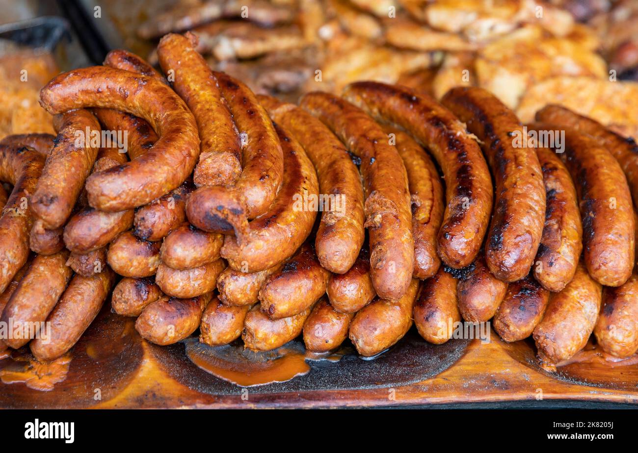 Traditional fatty german street food - fried sausages on plate in ...