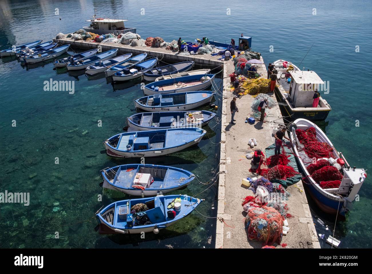 Italy, region of Apulia: Gallipoli; Boats and fishermen in the fishing ...
