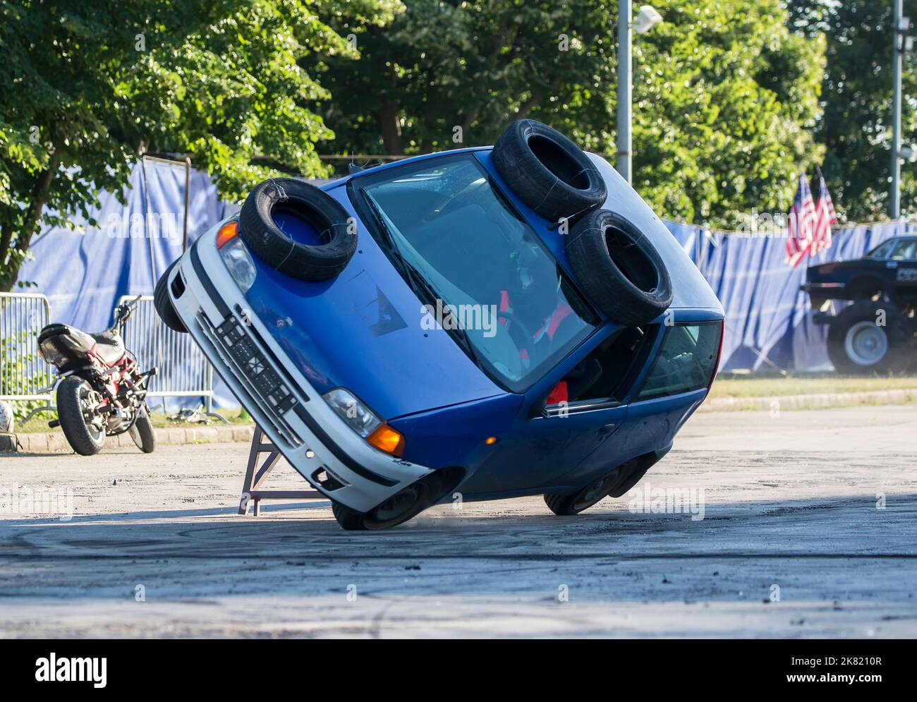 Car turn over right now in street at accident Stock Photo - Alamy