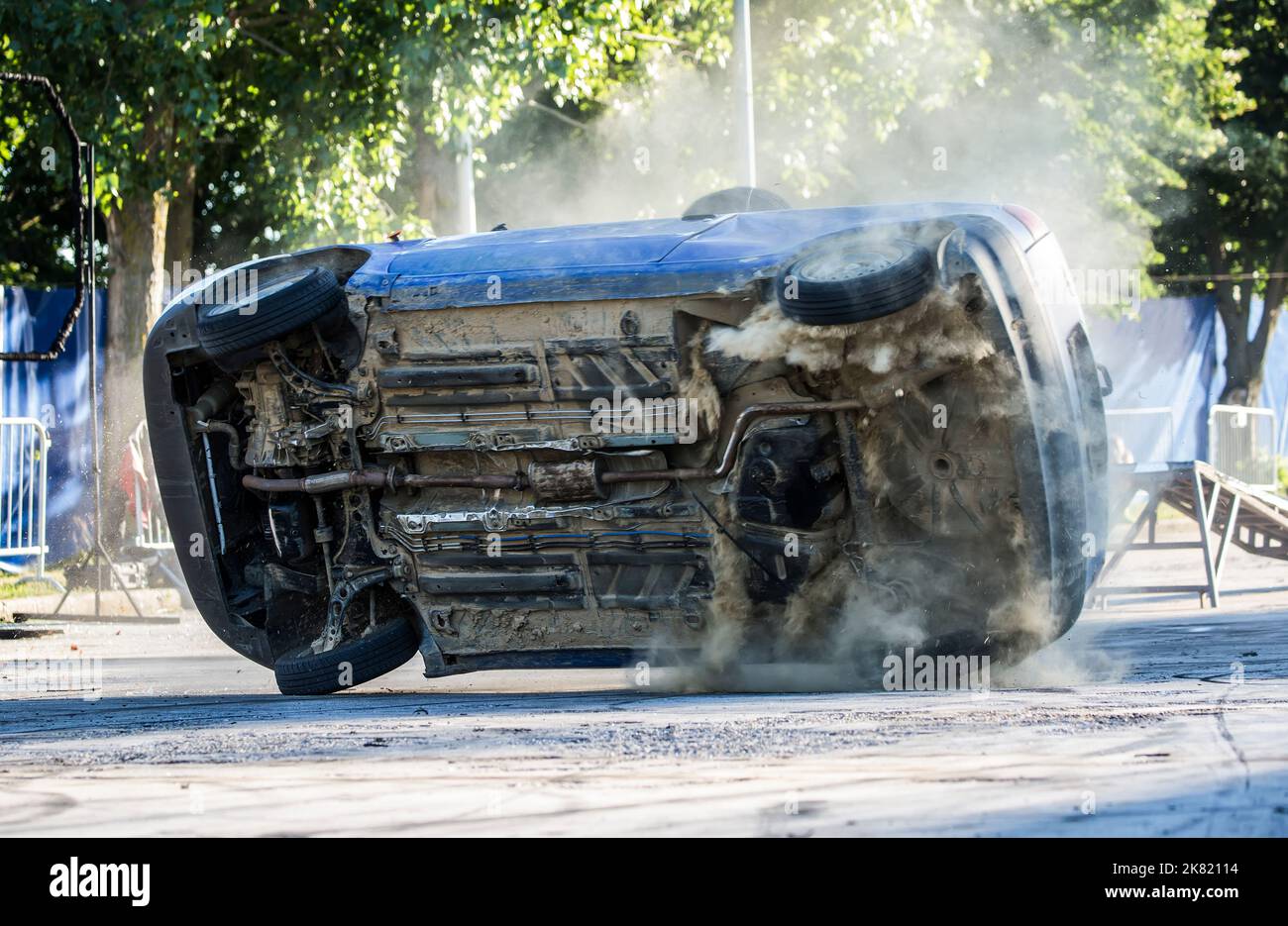 Car turn over right now in street at accident Stock Photo - Alamy
