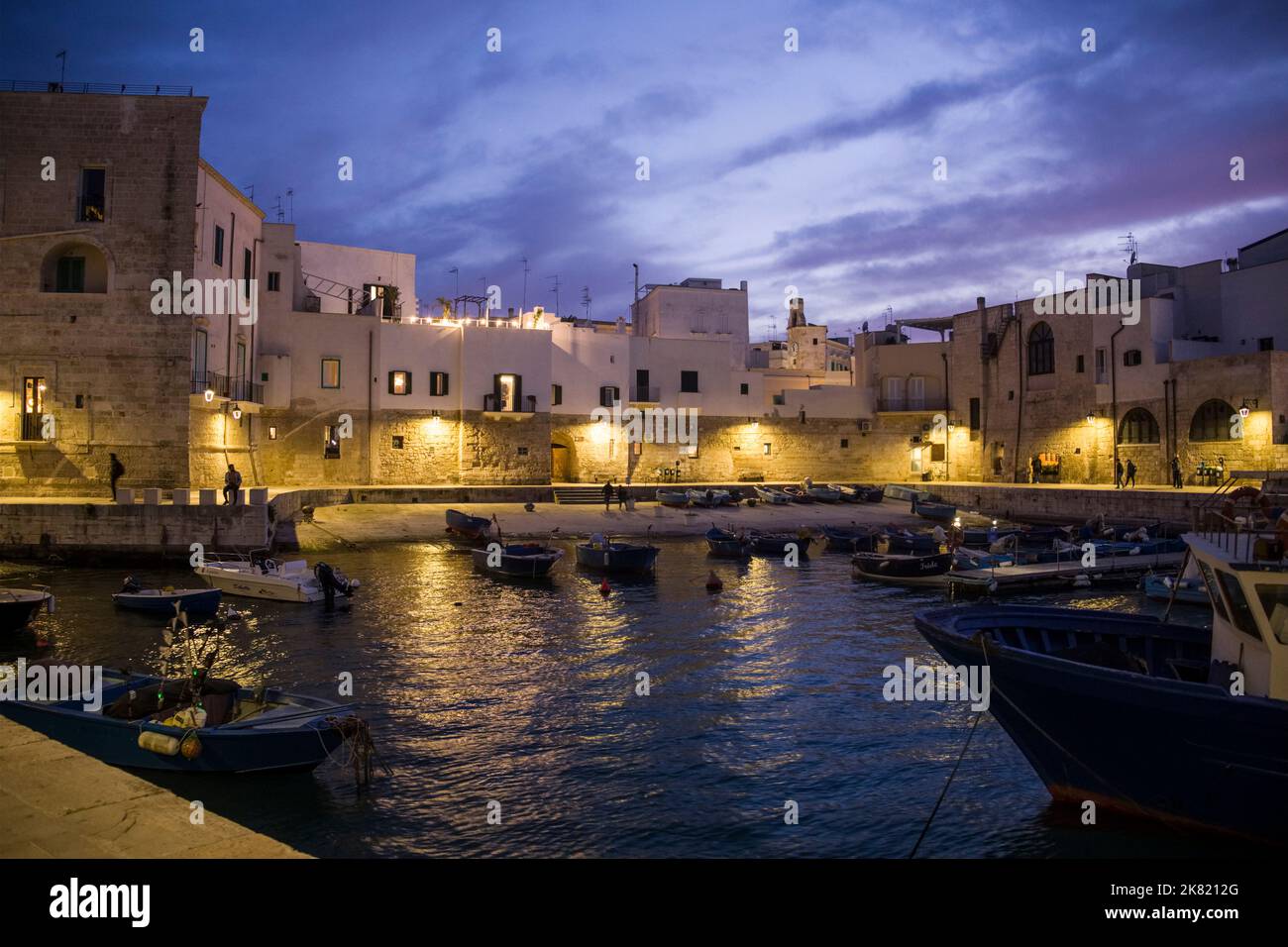 Italy, region of Apulia: Monopoli. The old harbour at night Stock Photo ...