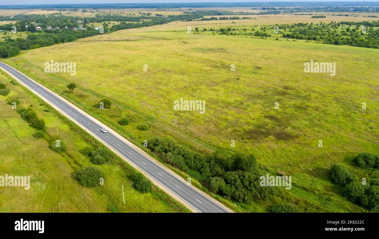 Top view of a road on a flat terrain on a summer day Stock Photo - Alamy