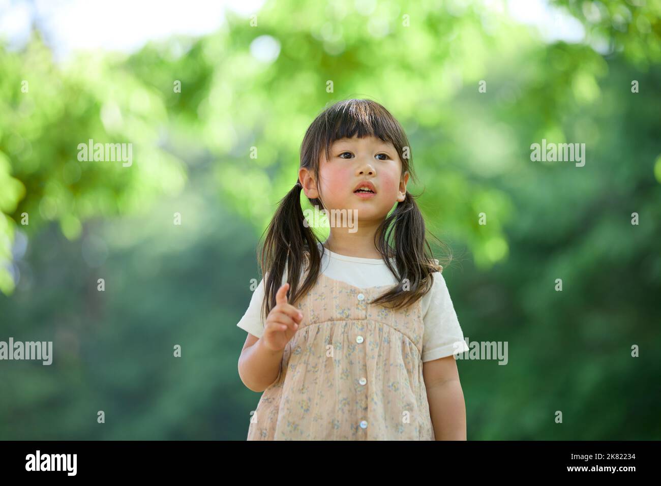 Japanese kid in a city park Stock Photo - Alamy