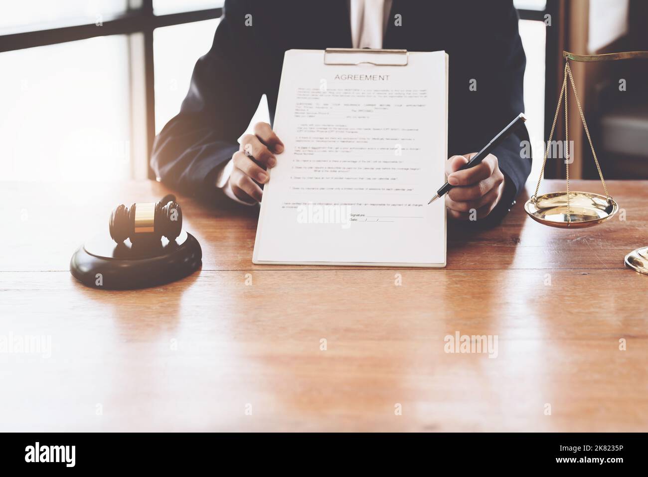 Discussing legal matters and signing important documents Stock Photo ...
