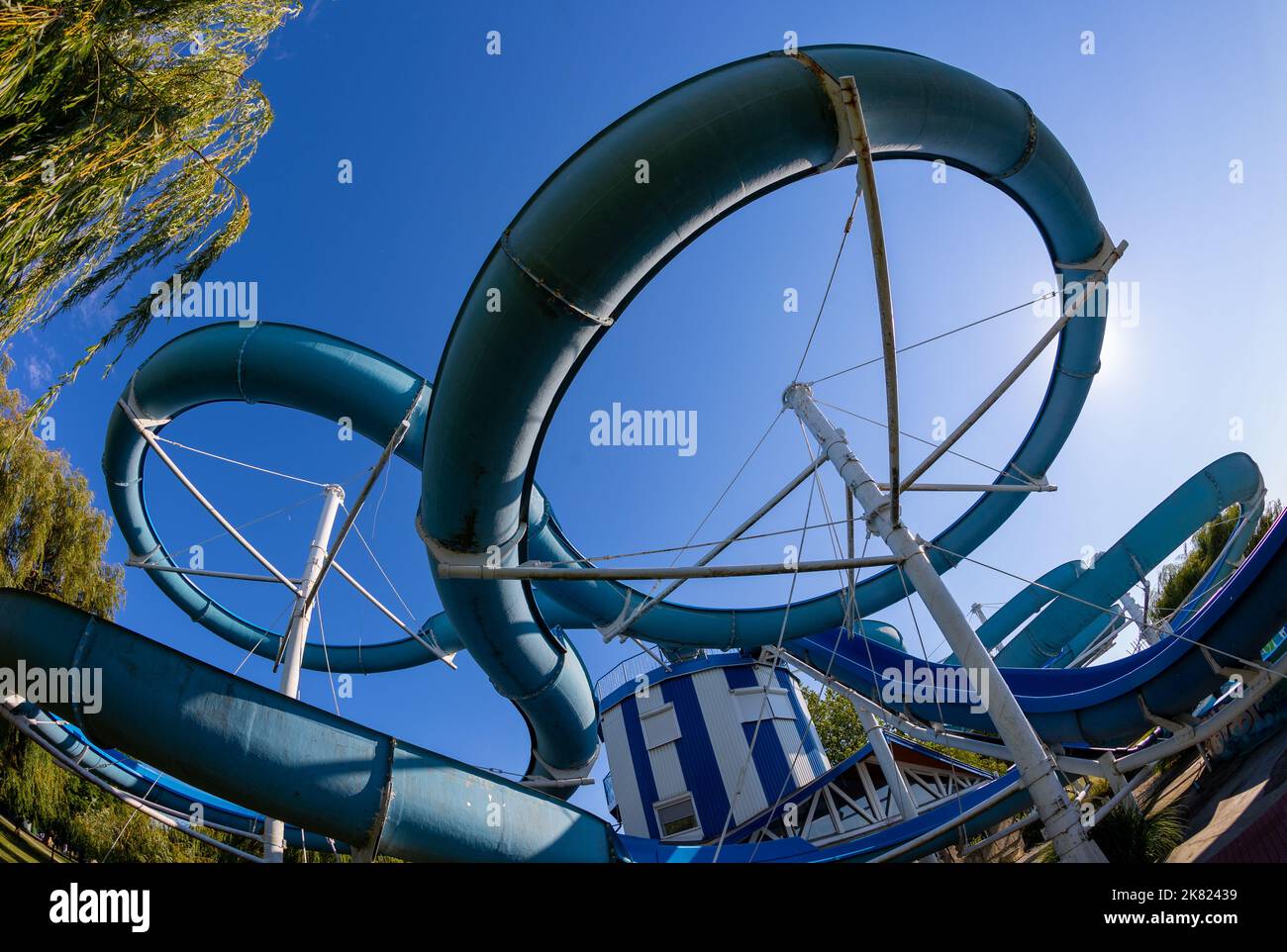 Water slide in aquapark against blue sky Stock Photo - Alamy