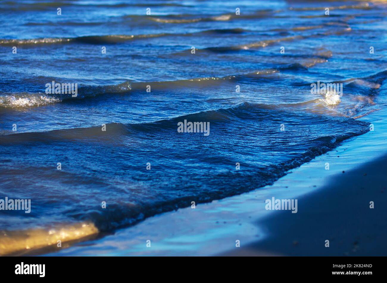 Edge of water waves at shore Stock Photo - Alamy