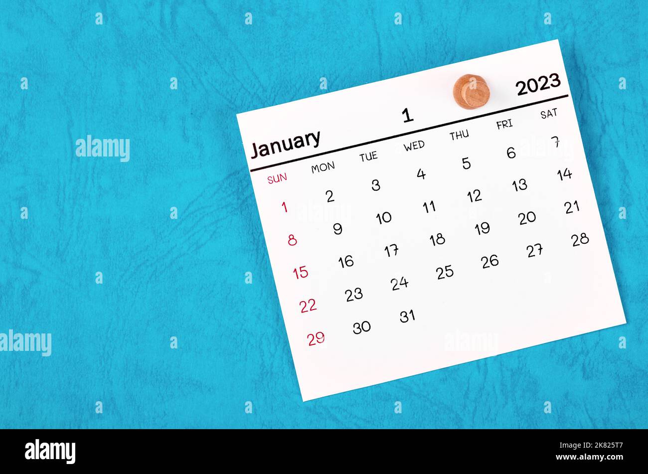 January 2023 and wooden push pin on blue background Stock Photo - Alamy