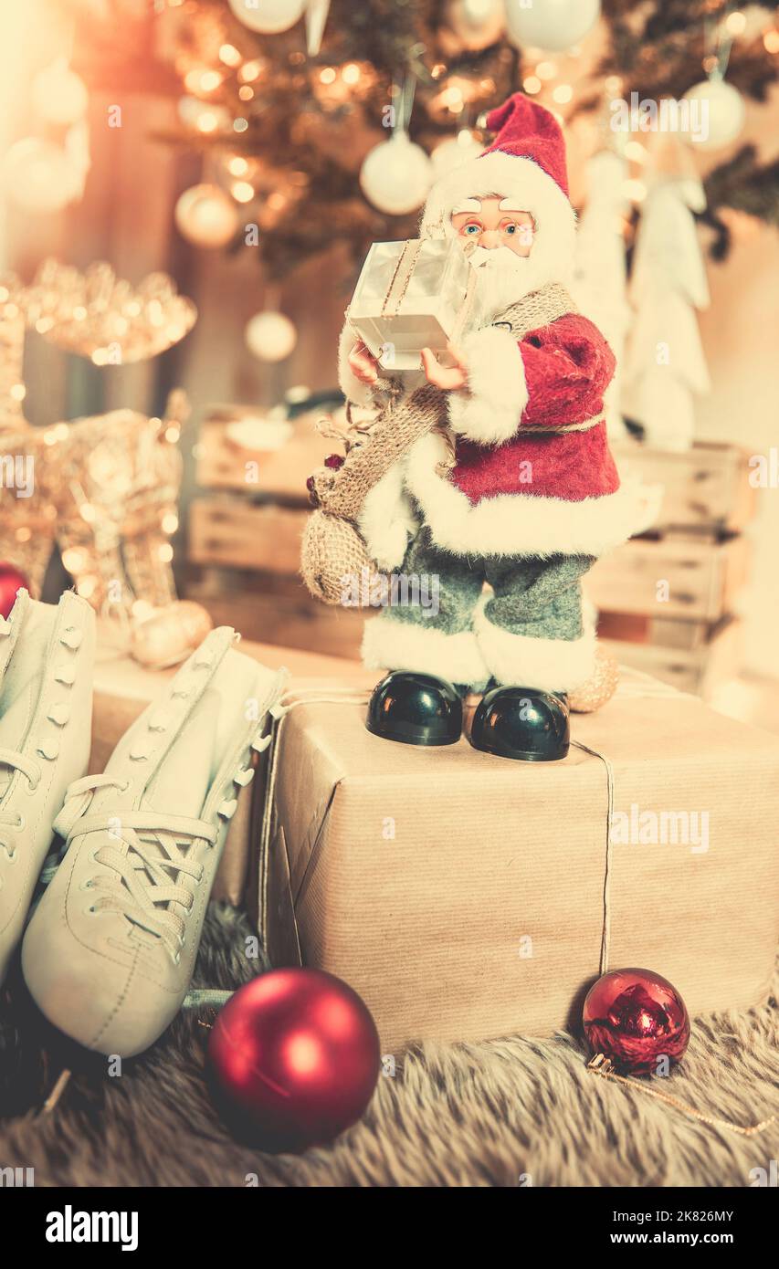 Santa claus figurine at christmas tree Stock Photo - Alamy