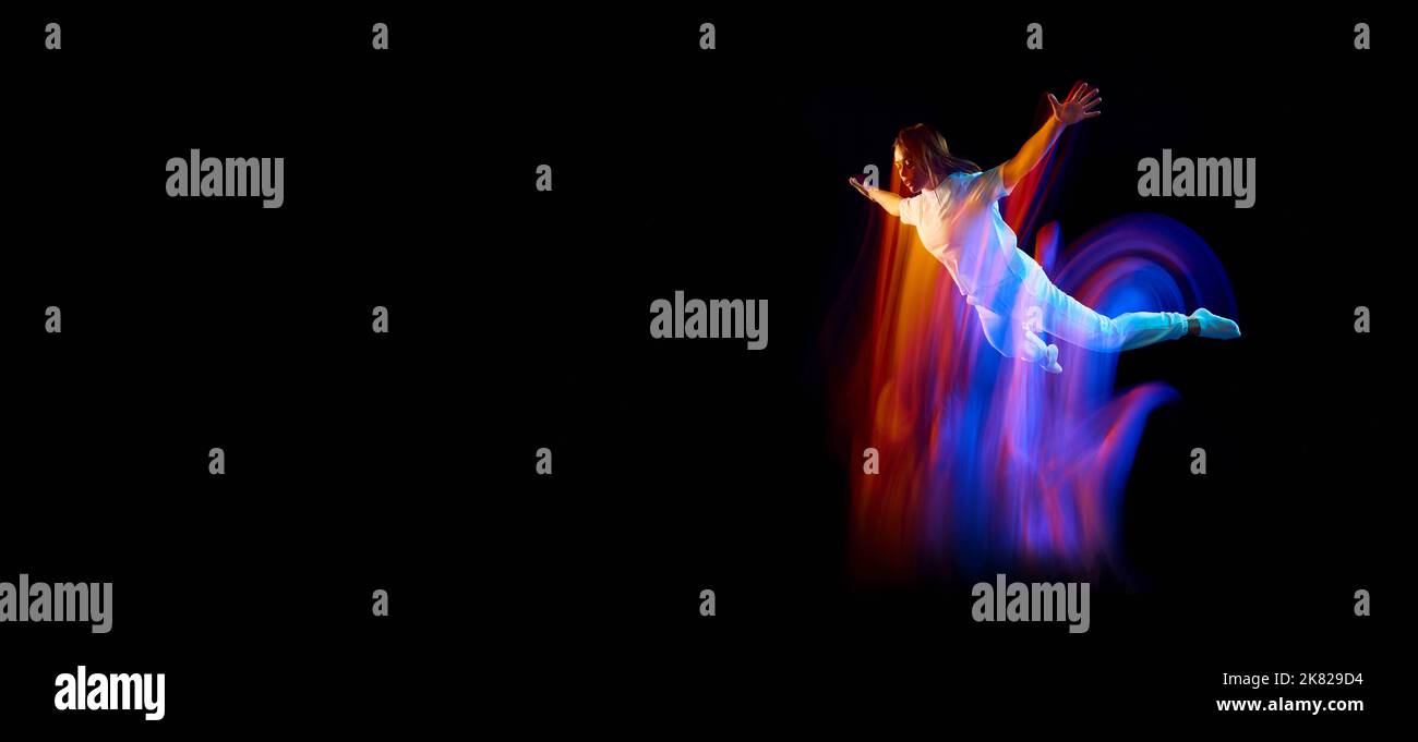 Dance in motion. Studio shot of flying, jumping dancer or gymnast ...