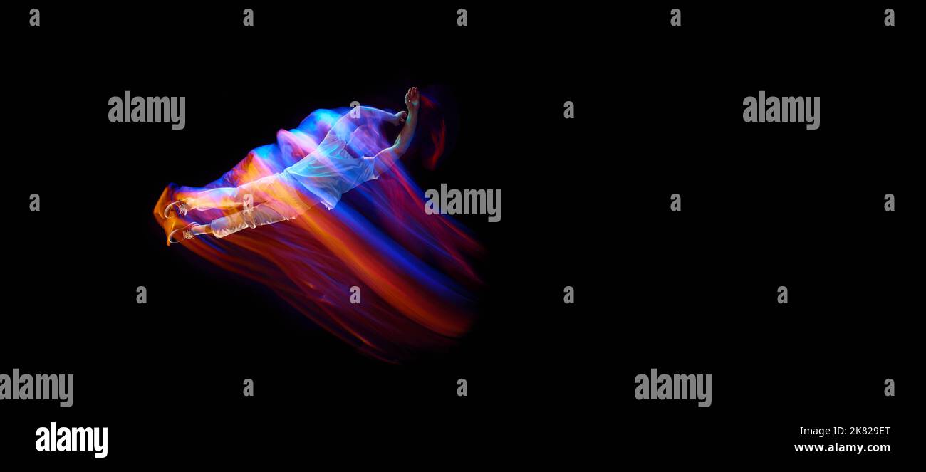 Dance in motion. Studio shot of flying, jumping dancer or gymnast ...