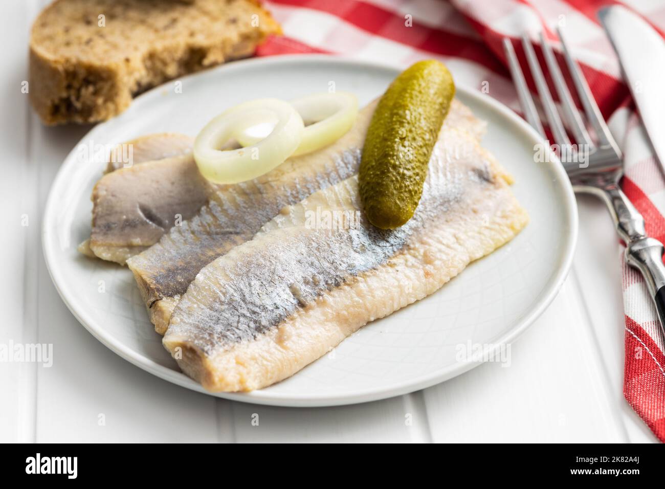 Marinated herring fish on the plate Stock Photo - Alamy