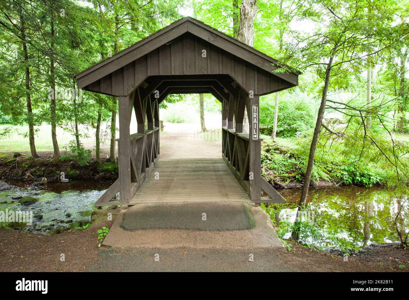 Covered Footbridge in a park Stock Photo - Alamy