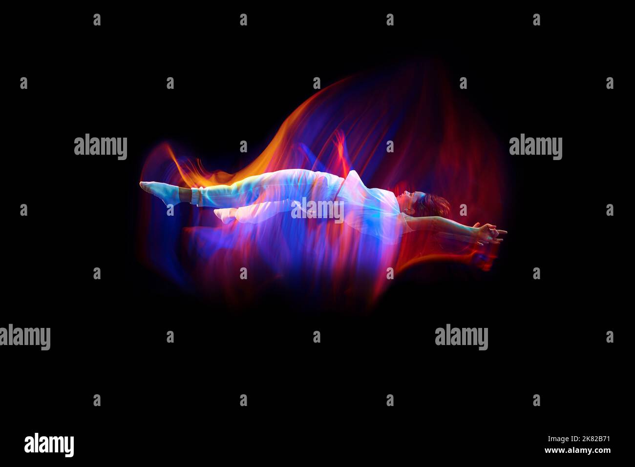 Dance in motion. Studio shot of flying, jumping dancer or gymnast ...