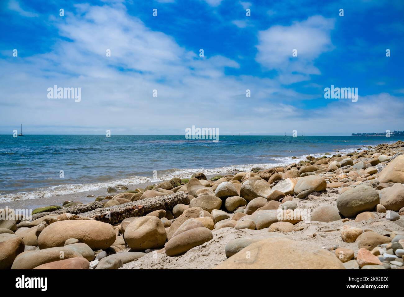 Big light polished stones on Butterfly beach Santa Barbara. Holiday in ...