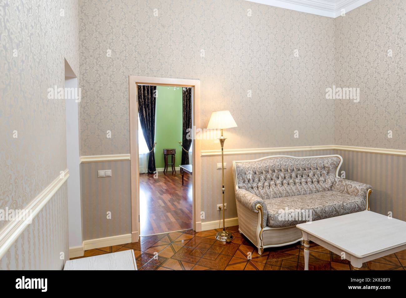 Hallway in a house with wooden floor and doors to other rooms Stock ...