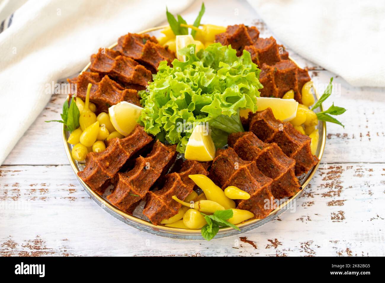 Cig kofte or raw meatballs on wood background. Traditional Turkish ...