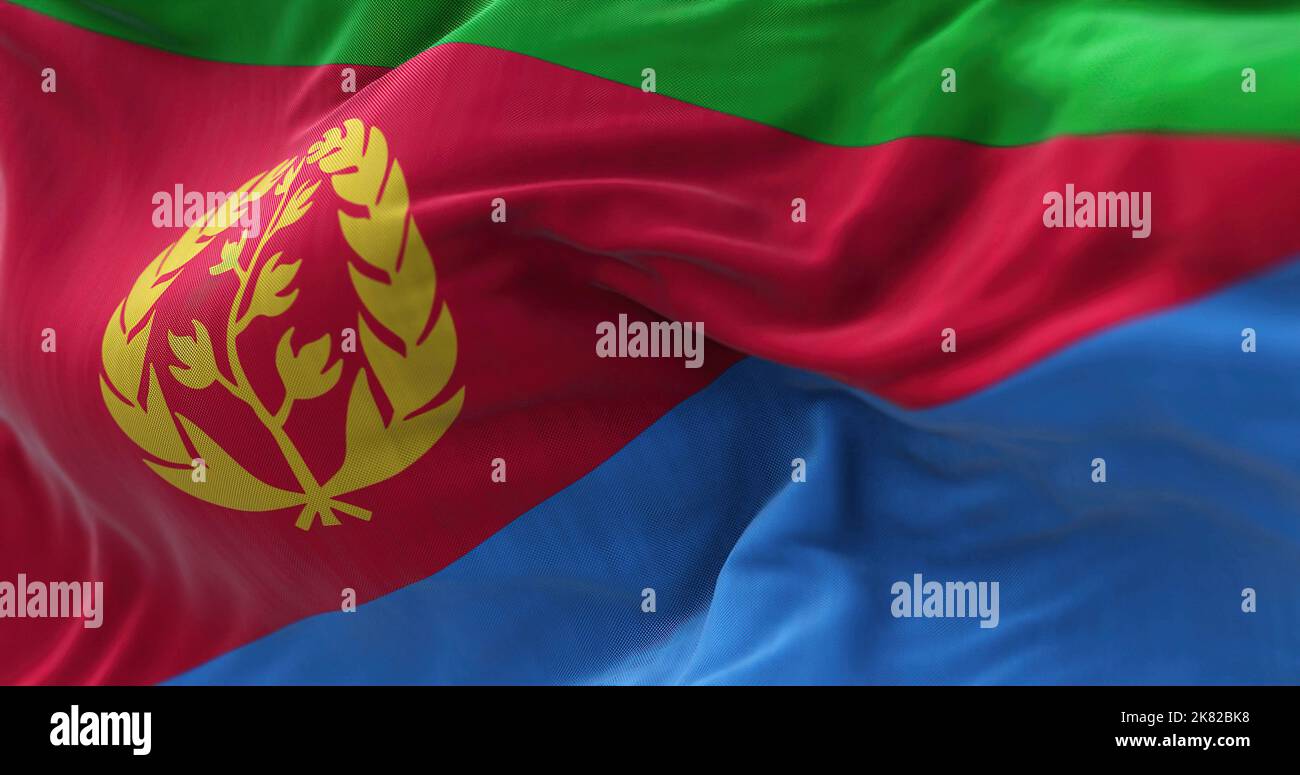 Close-up view of the Eritrea national flag waving in the wind. The ...