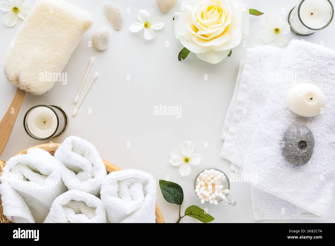 An arrangement of elegant spa items all in white with copy space in the ...