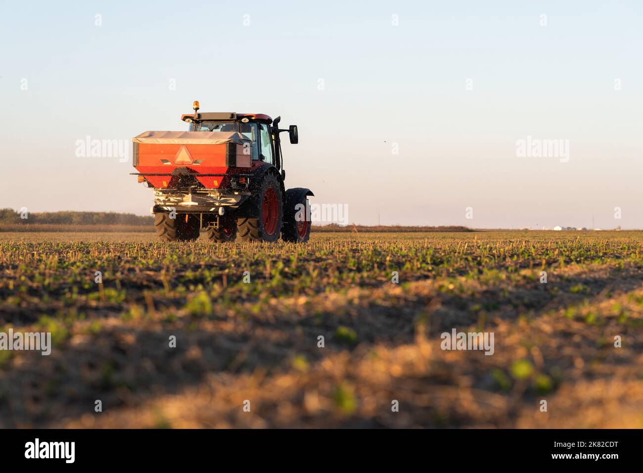 Tractor spreading artificial fertilizers. Transport, agricultural Stock ...