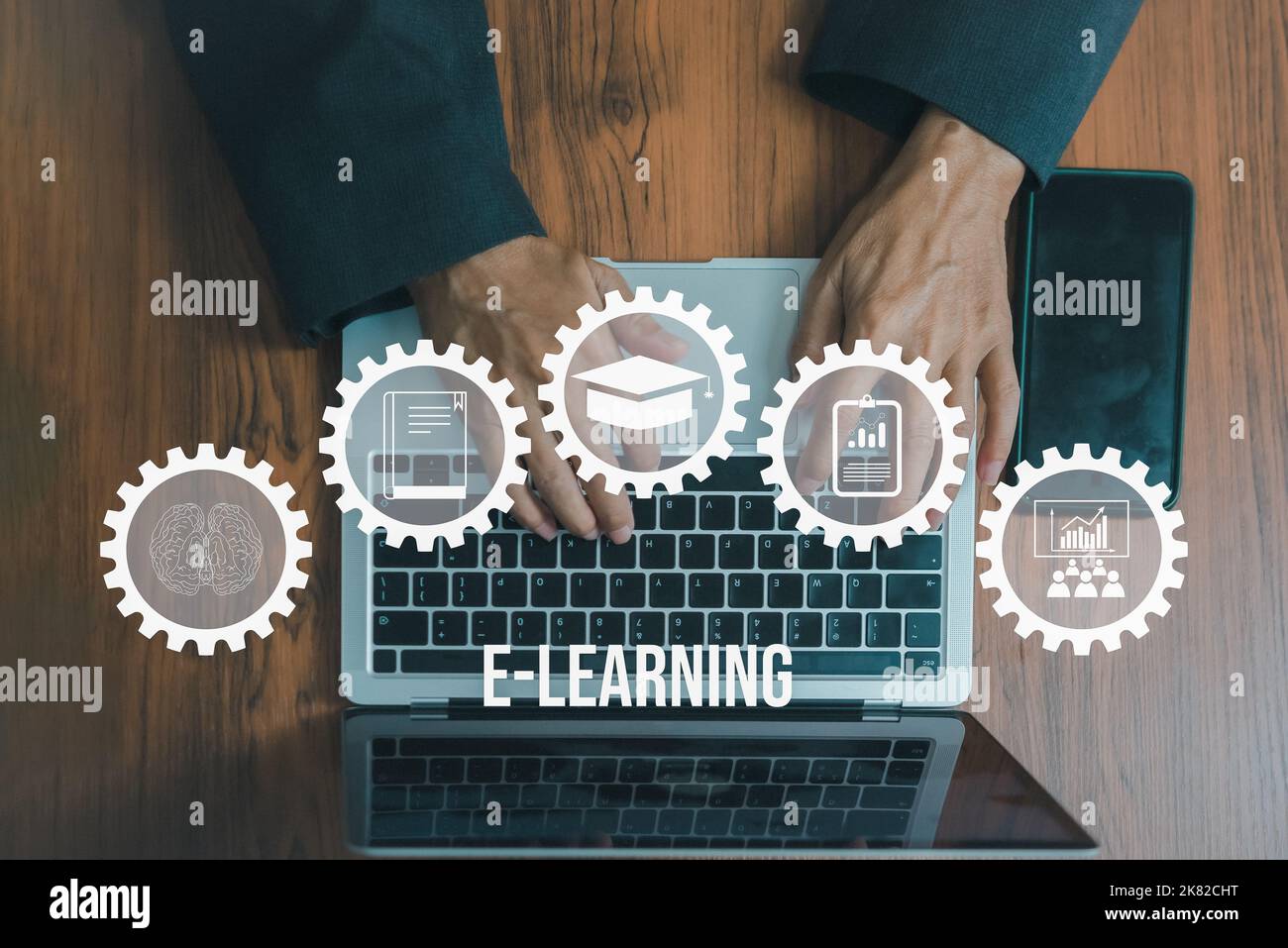 Education online e learning with connected gear icons.Hand using laptop ...