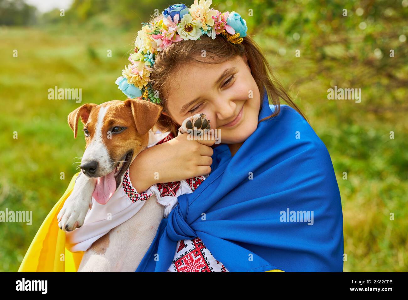 The Ukrainian girl hugs her dog Stock Photo - Alamy