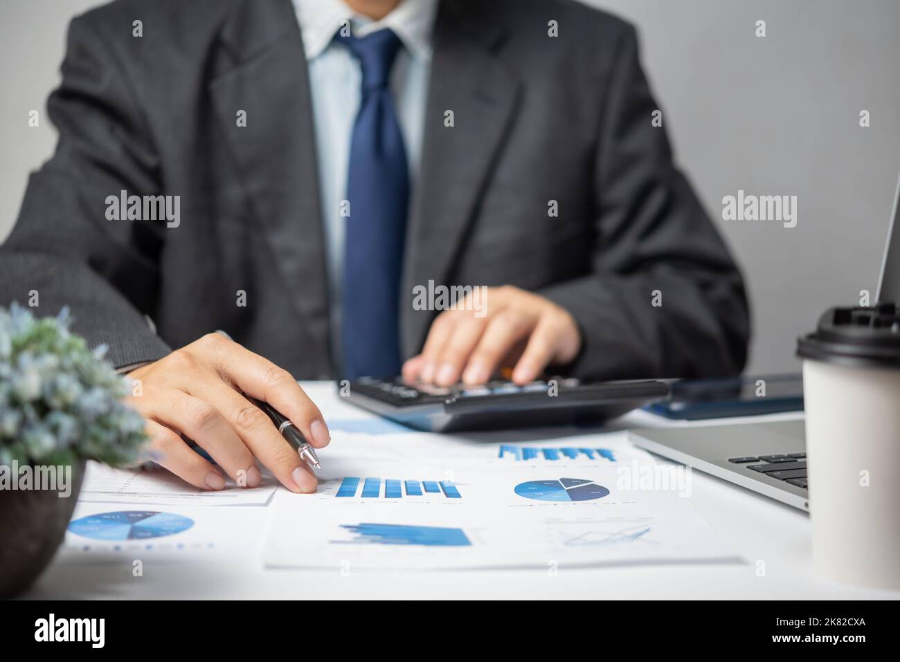 Businessman hand pointing paperwork chart report analysis statistic and ...