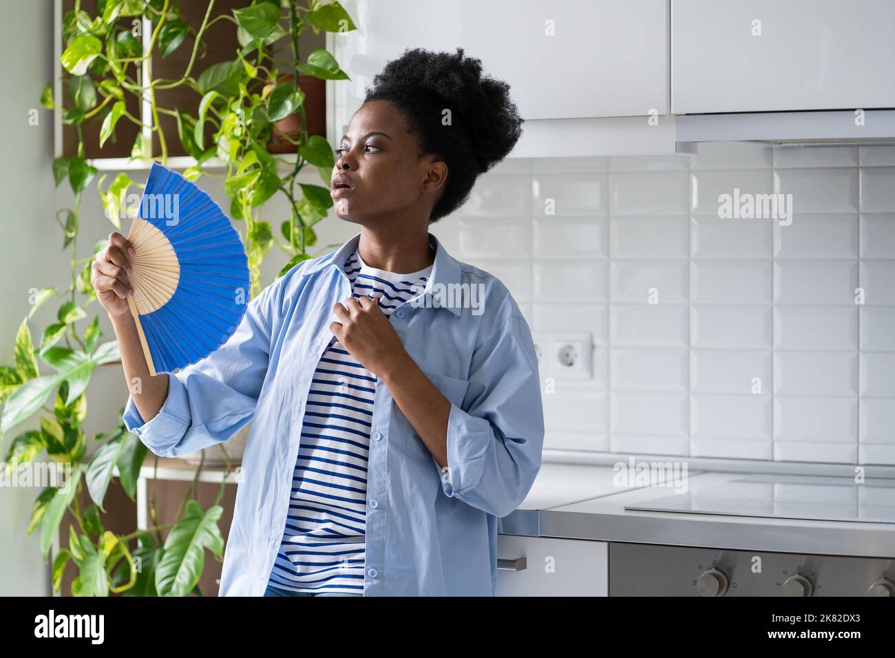 Woman fanning herself in the heat hi-res stock photography and images ...