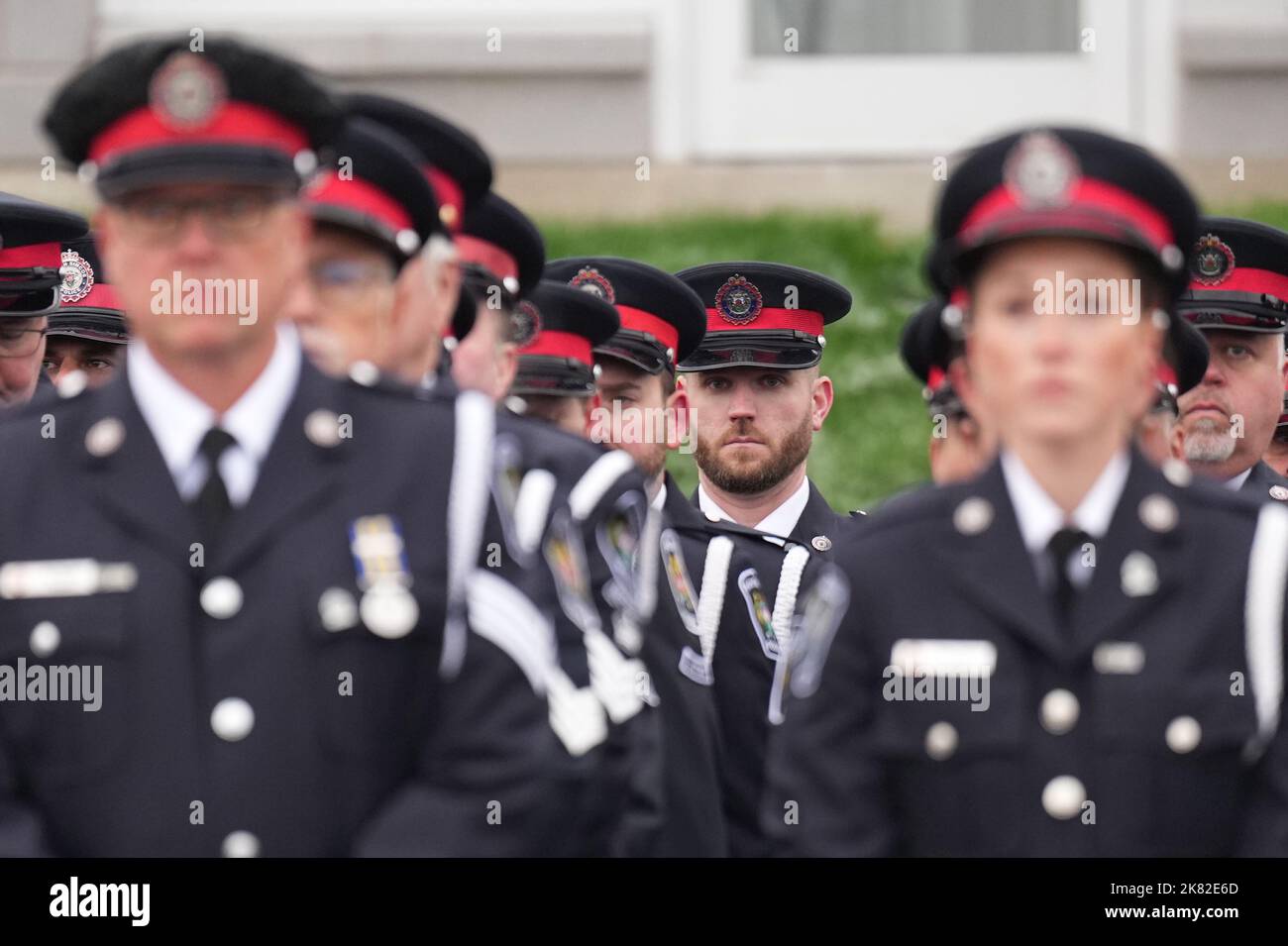 South Simcoe Police Service officers line up in a procession before the ...