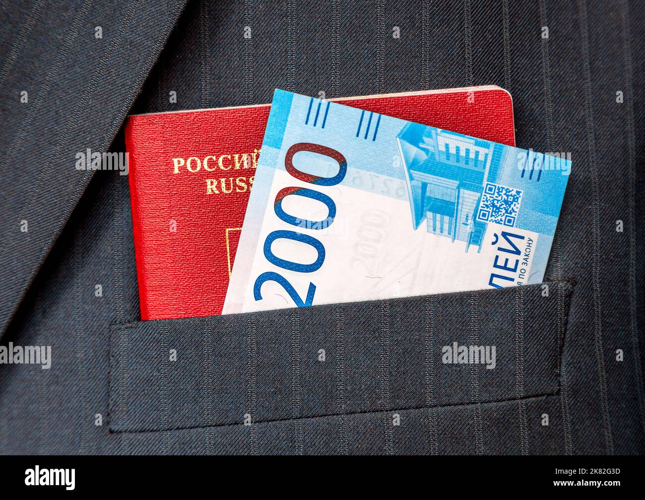 Banknotes of Russian rouble currency and Russian passport in business ...