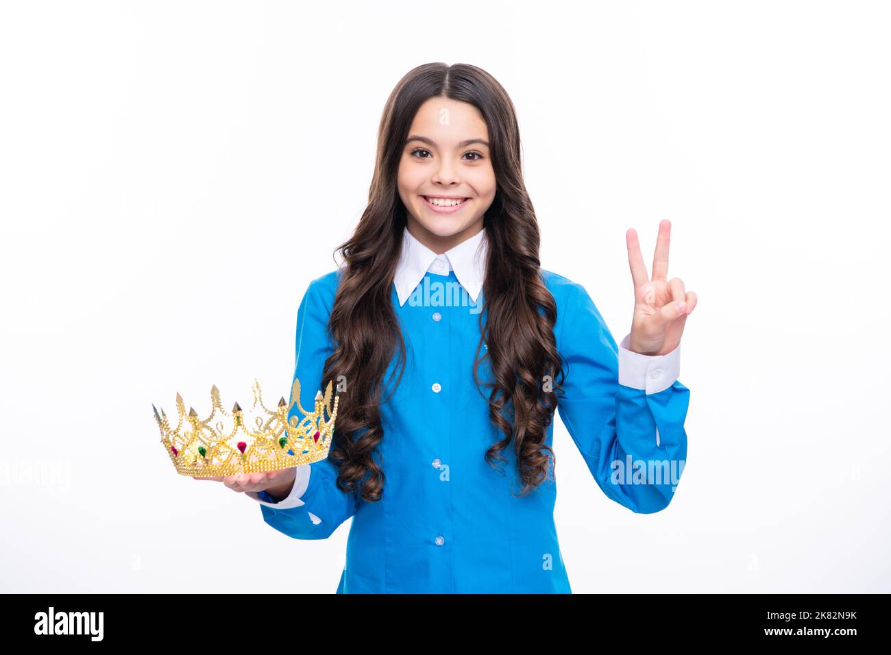 Girls birthday party, funny kid in crown. Imagine herself a queen ...