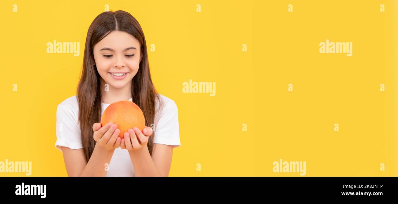 happy teen girl with grapefruit. vitamin and dieting. child eating ...