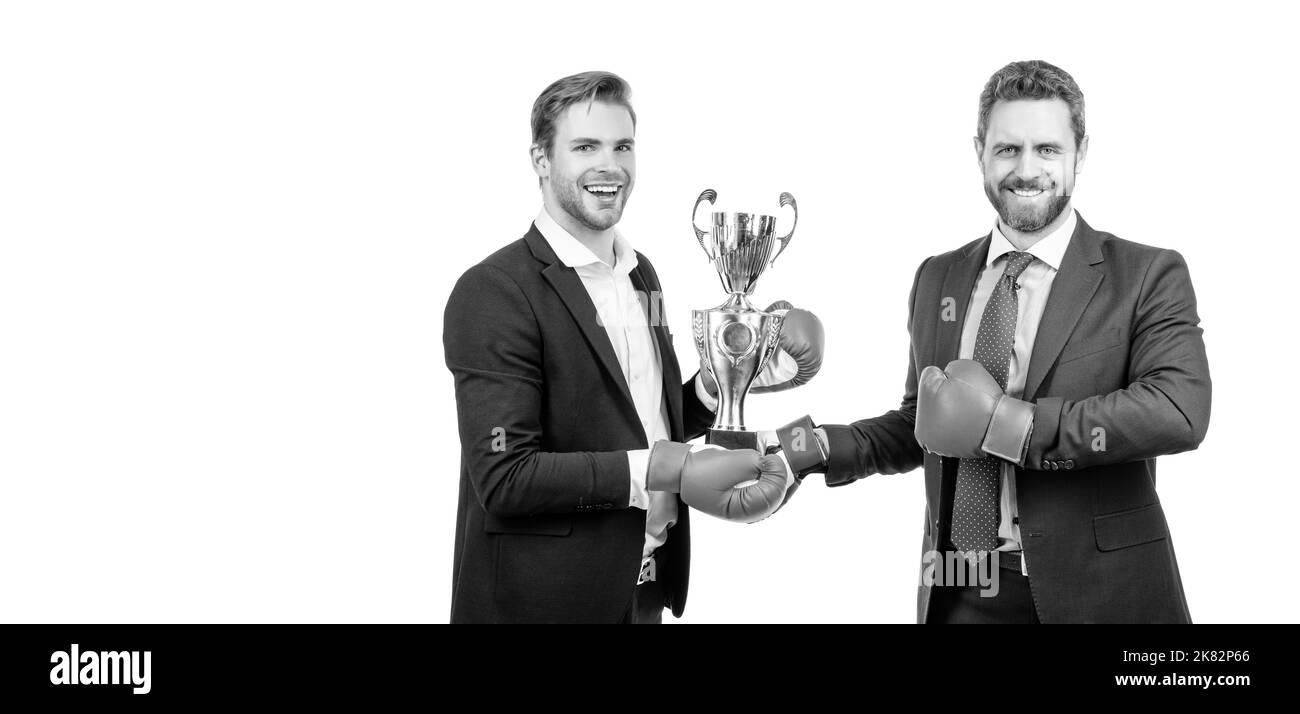 happy partners hold golden cup. business achievement award. celebrating ...