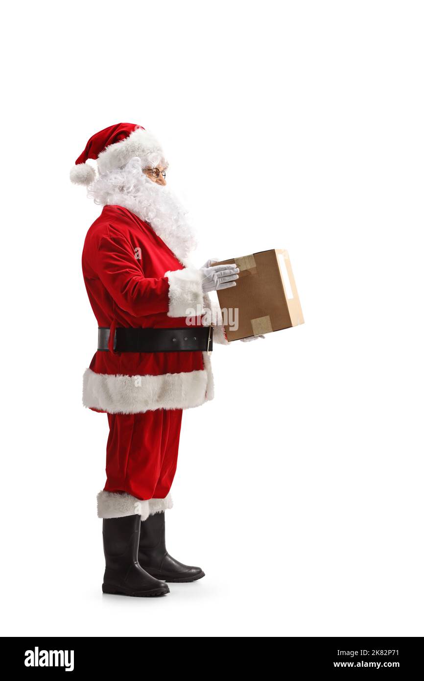 Full length profile shot of santa claus delivering a cardboard box ...